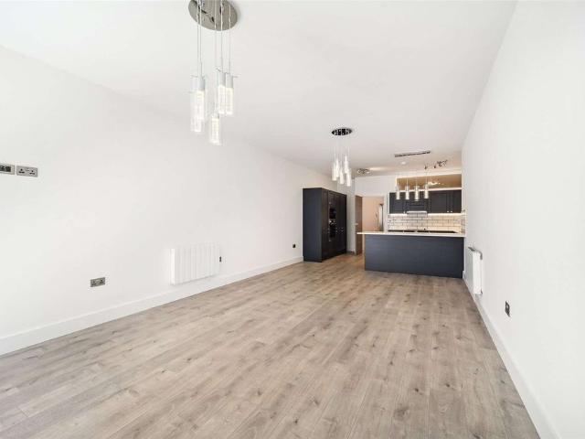 A charming two bedroom apartment with a private patio