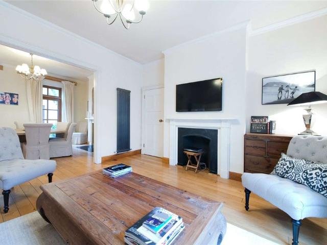 A charming terraced house providing spacious and neutrally decorated accommodation with a garage, off street parking and a garden