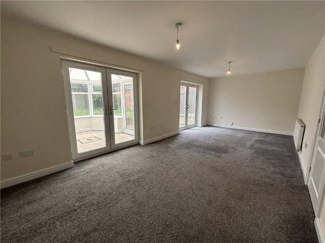 A detached 3/4 bedroom dormer bungalow with a garage and driveway parking in Bramley