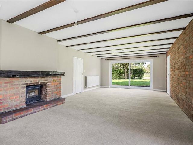 A detached 4 bedroom cottage with a double garage, good sized garden, 6 stables and approximately 8 acres of land in Great Missenden