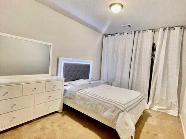 A fancy furnished master bedroom