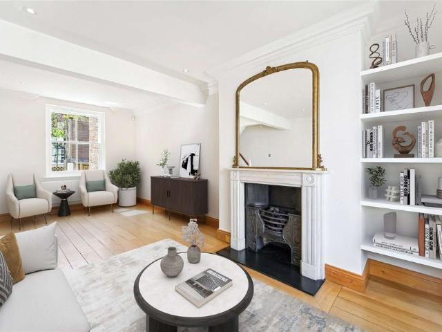 A fantastic five bedroom house, with separate terrace, tucked away in a pretty street seconds from the shops, bars and restaurants of the Kings Road