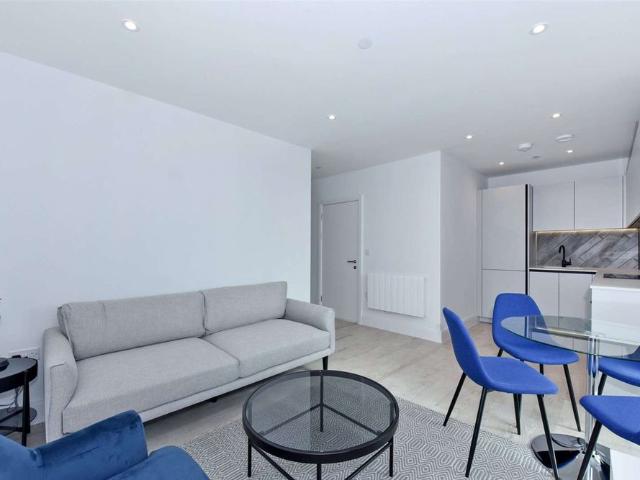 A first floor furnished apartment with south facing private balcony in the sought after Horlicks Artesian House development by Berkeley Homes