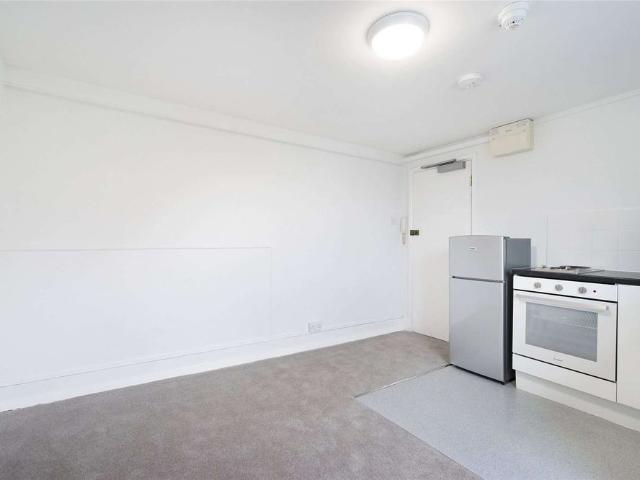 A fourth floor studio apartment situated on Cranley Place, a quiet residential street in South Kensington