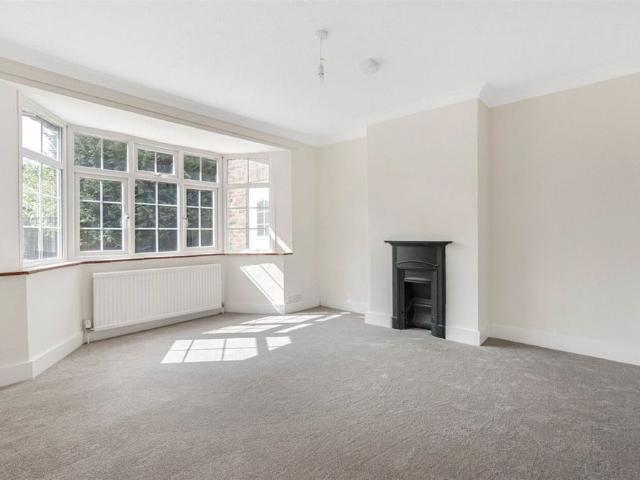 A four bedroom detached bungalow with a garden and driveway