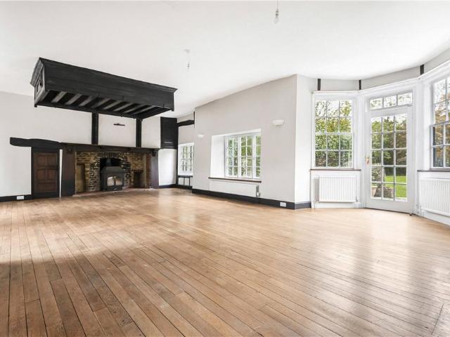 A Grade ll listed detached family home over 3 floors, with 2 double garages and driveway parking in Ickenham