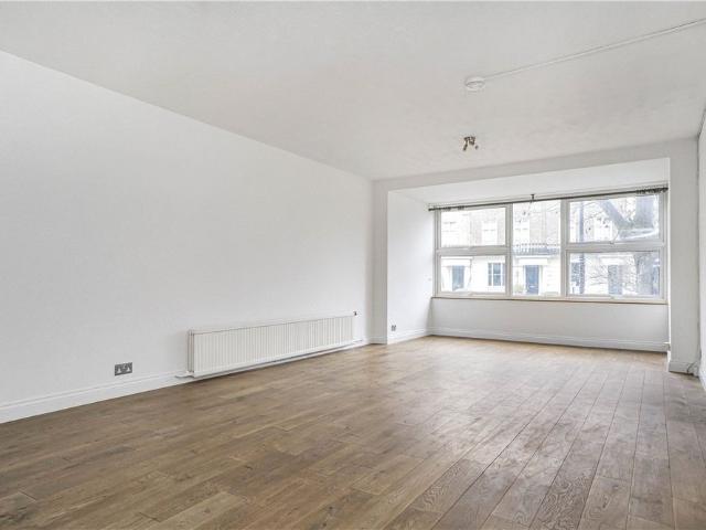 A ground floor two bedroom apartment with a communal garden and underground parking in Camden. Inclusive of heating and hot water