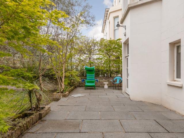 A handsome five bedroom townhouse with a large garden in W2