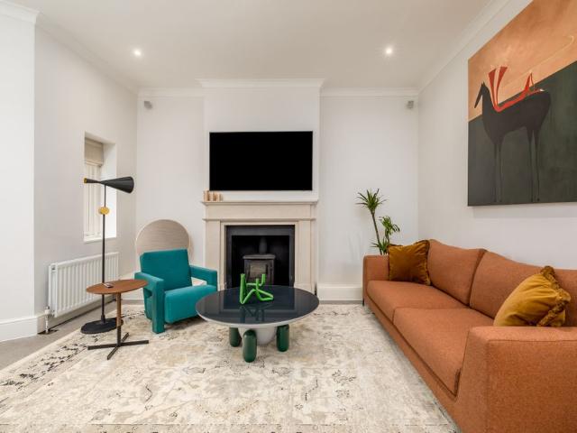 A handsome five bedroom townhouse with a large garden in W2