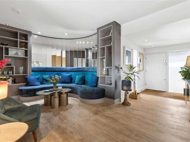A highly individual, architecturally designed contemporary home set within beautifully landscaped gardens on the Thames riverfront