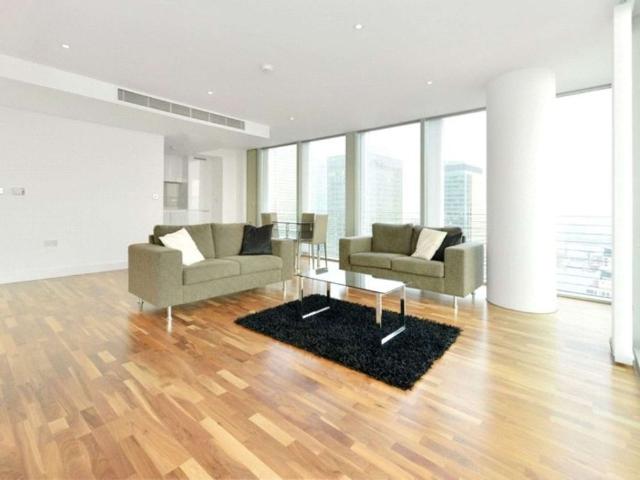 A luxury interior designed three bedroom apartment situated on the thirty seventh floor, over looking Canary Wharf
