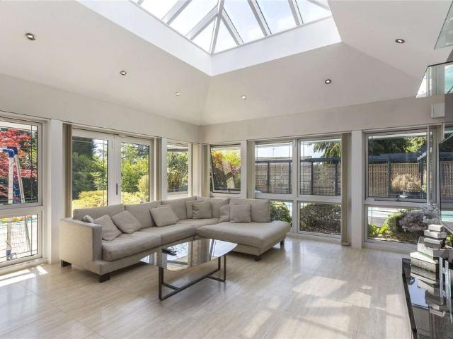 A landmark Arts and Crafts inspired home by Altin Homes on one of Hale’s most prestigious roads, set within approximately one third of an acre with exceptional leisure facilities