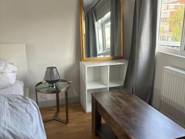 A large top floor furnished room with ensuite shower. There is a small kitchen area, fridge, microwave within the room