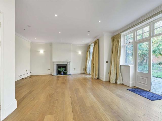 A lovely gated family home with off street parking and generous gardens backing on to Richmond Park