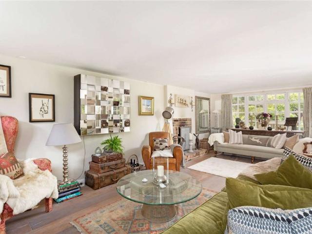 A pretty brick and flint detached cottage offering a wealth of charm and character with a delightful country garden in a tranquil yet convenient setting