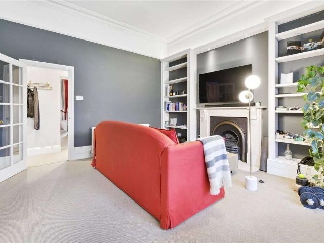 A raised ground floor furnished flat with access to communal gardens