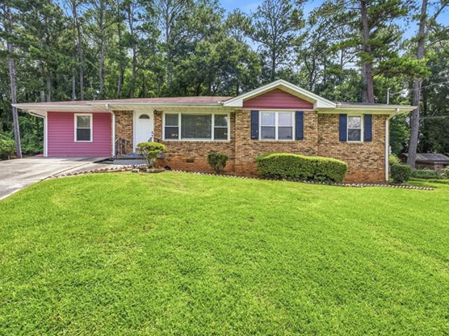 A rare oversized backyard, cozy fire pit, and bright sunroom make this Southeast Atlanta home stand out.