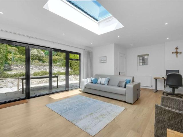 A stunning character home located in a private estate moments from Esher high street