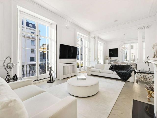 A stunning first floor apartment, beautifully refurbished and interior designed to a very high specification with dual aspect views and a private balcony
