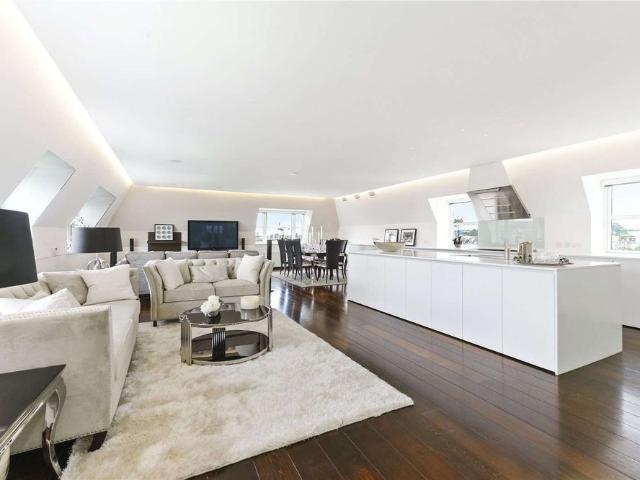 A stunning triplex penthouse apartment featuring a fabulous reception room and a private roof terrace