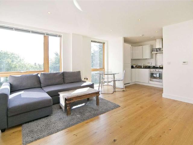 A stylish contemporary two bedroom fifth floor apartment with outside space