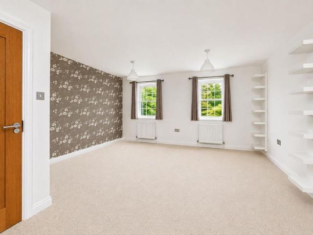 A stylish and spacious four bedroom home in the heart of Weybridge, offering flexible living across three floors and a generous family friendly garden
