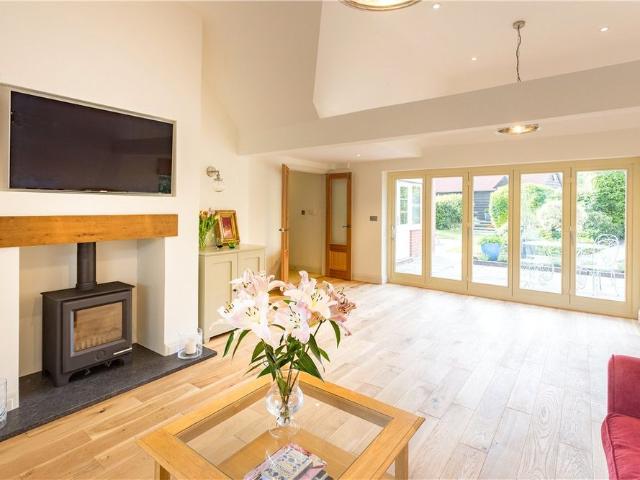 A substantial and attractive four bedroom thatched cottage with a one/two bedroom annexe, outbuildings and extensive gardens