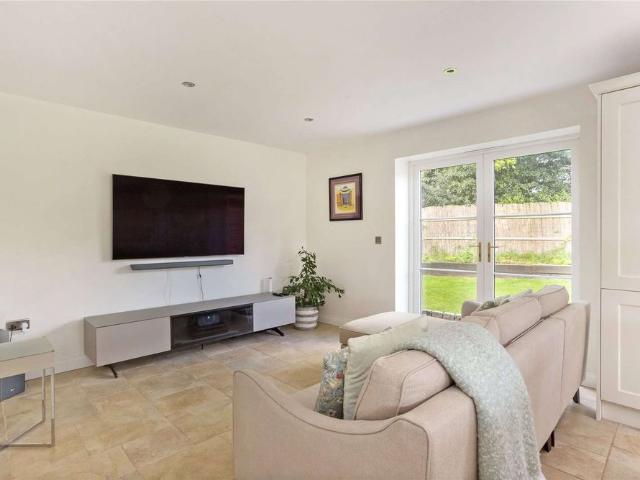 A superb high specification, energy efficient family home constructed in 2019, with wraparound garden, detached garage and wonderful views