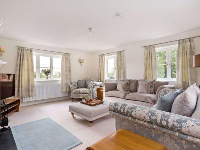 A superb high specification, energy efficient family home constructed in 2019, with wraparound garden, detached garage and wonderful views