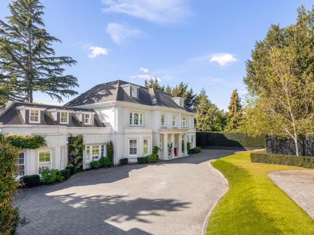 A secluded detached house at the end of a private driveway on Coombe Lane West