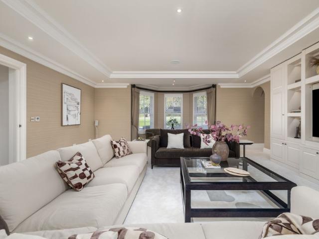 A secluded detached house at the end of a private driveway on Coombe Lane West
