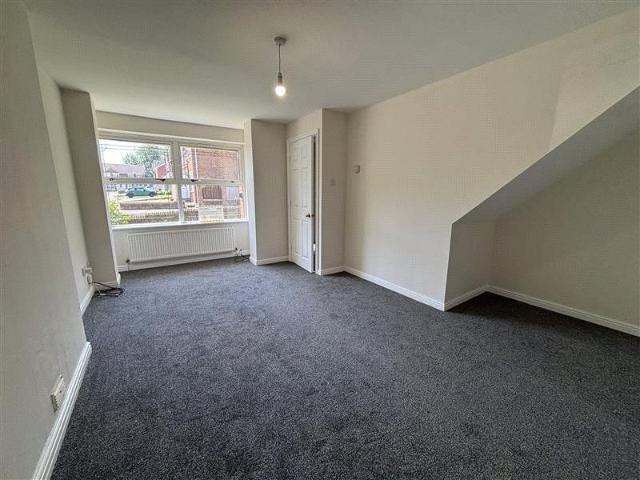A semi detached, three bedroom property of brick construction