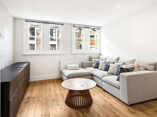 A spacious three bedroom apartment with modern kitchen and bathrooms