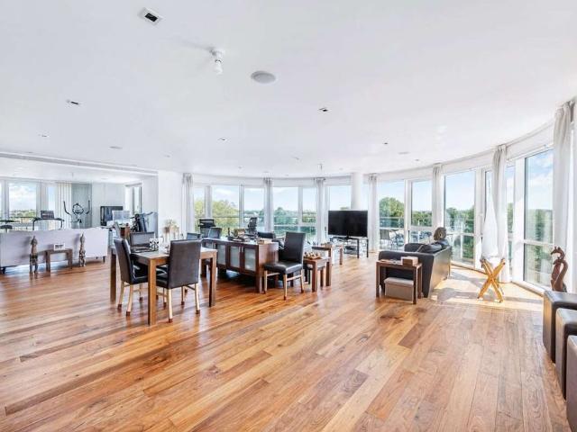 A spacious and contemporary three bedroom apartment with south facing balconies overlooking the River Thames
