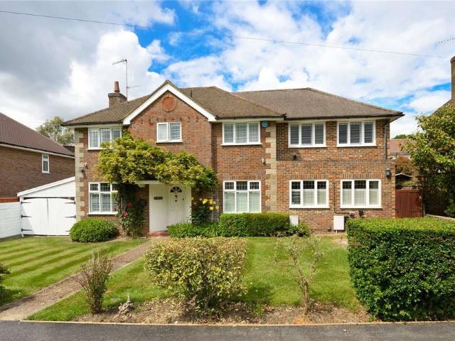 A spacious detached family home located on a desirable road in Oxshott