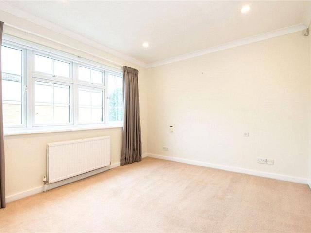 A spacious family home arranged over three floors with private garden and balcony, moments from St John’s Wood High Street