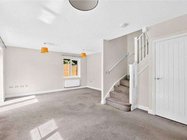 A spacious three bedroom semi detached family home, benefiting from an allocated parking space and an enclosed private rear garden