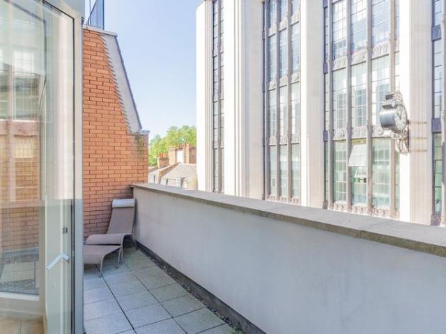 A spectacular two bedroom apartment set on the second floor within this modern building in the heart of fashionable Kensington