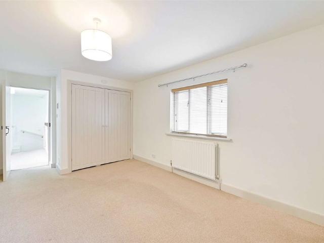 A two bedroomed character apartment in the town centre with parking