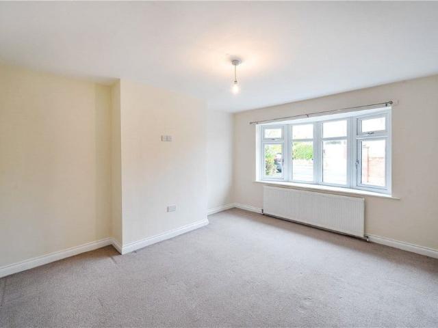 A three bedroom bungalow with a garage, off street parking and a large rear garden