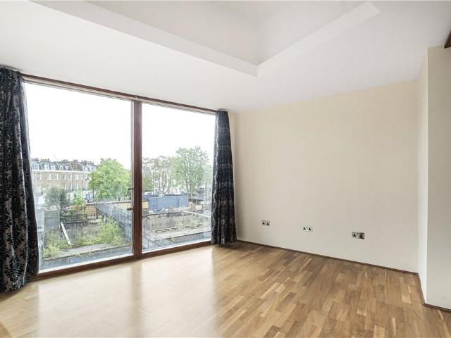 A top floor two bedroom apartment in a gated development