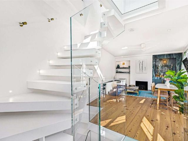 A traditional brand newly refurbished two bedroom mews house featuring layers of glass channelling light throughout