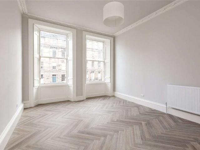 A truly stunning, fully refurbished, three bedroom ground floor apartment, located in Edinburgh New Town