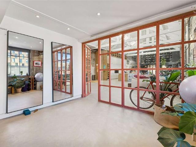 A unique 3,500 sq ft penthouse in a Grade II listed Victorian factory conversion, combining modern open plan living with original industrial character