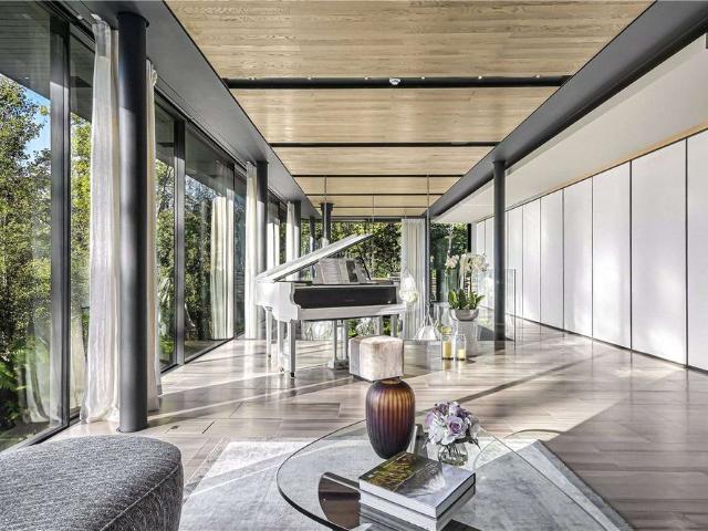 A unique and sustainable Stanton Williams–designed family home spanning 6,186 sq ft, set within the Highgate Conservation Area with views towards Hampstead Heath and a swimming pool
