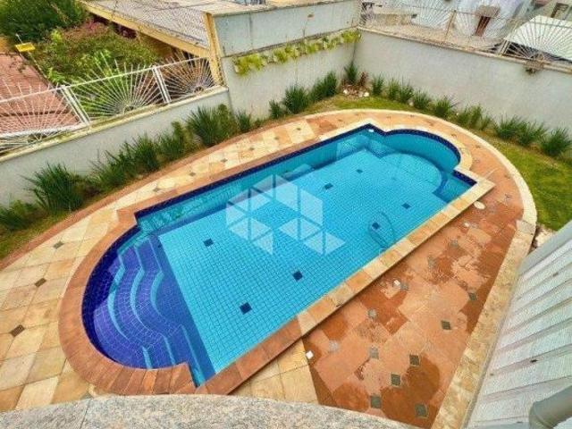 À venda, casa com 570 m², 3 dormitórios, sala de jogos, sala de cinema, piscina, vaga para 6 veícul