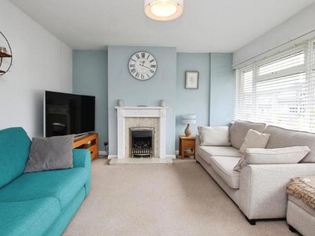A well presented two bedroom first floor flat with private entrance, garage and rear garden, ideally located for local amenities, major employers and excellent transport links