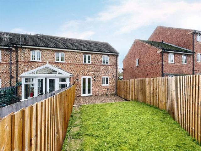 A well presented two storey 3 bedroom end terrace property with a detached terraced garage and off road parking for a single vehicle in front