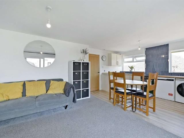 A well presented three bedroom home featuring an open plan reception room/kitchen, principal bedroom with ensuite, detached studio and office outbuilding, gardens, and off road parking