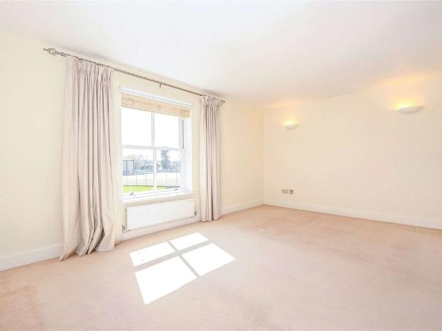 A well presented town house in a popular development on the outskirts of Windsor